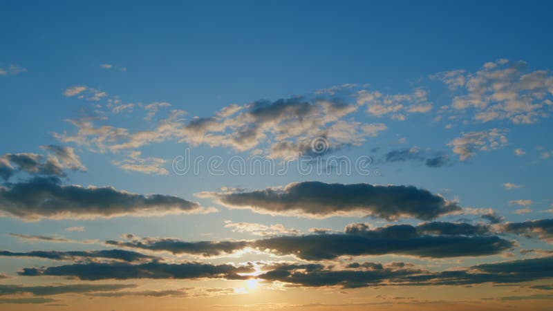 Cloudy Sunset Sky with Fluffy Clouds and Sun. Summer Sunset in Sky Haze ...