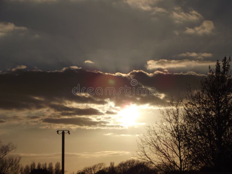 Cloudy Sunset stock photo. Image of cloudy, clouds, setting - 143174450