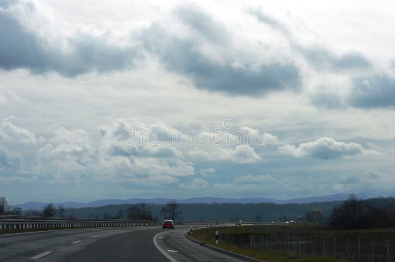 Cloudy Weather and a Car on the Highway Stock Image - Image of nature ...