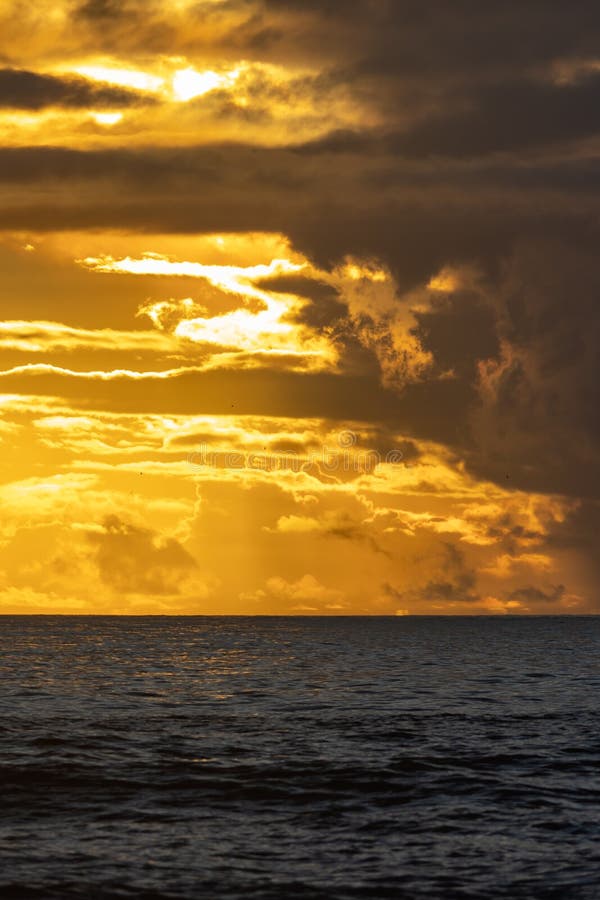 Cloudy Yellow Sunset Over the Dark Sea Stock Image - Image of dawn ...