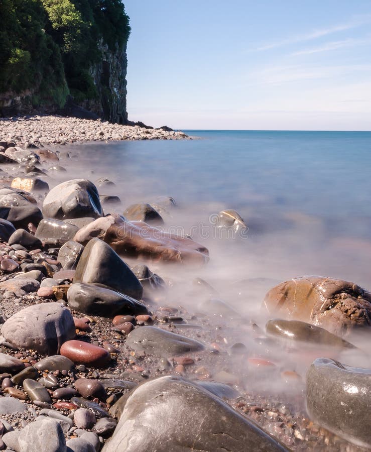 Clovelly Beach stock photo. Image of cliff, harbour, beach - 42225404