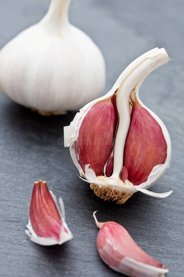 Cloves of fresh garlic stock image. Image of color, board - 11949655