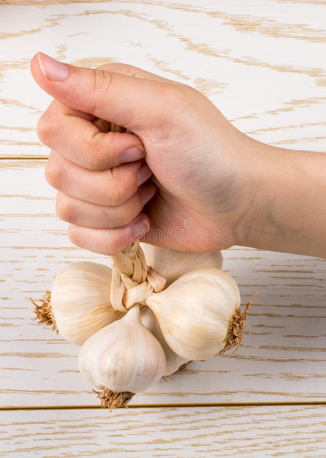 Cloves of Garlic in Hand in View Stock Photo - Image of peel, gourmet ...