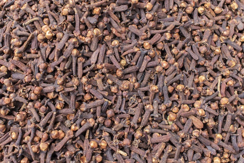 Cloves Spice in a Wooden Spoon on a Light Kitchen Table, Top View Stock ...