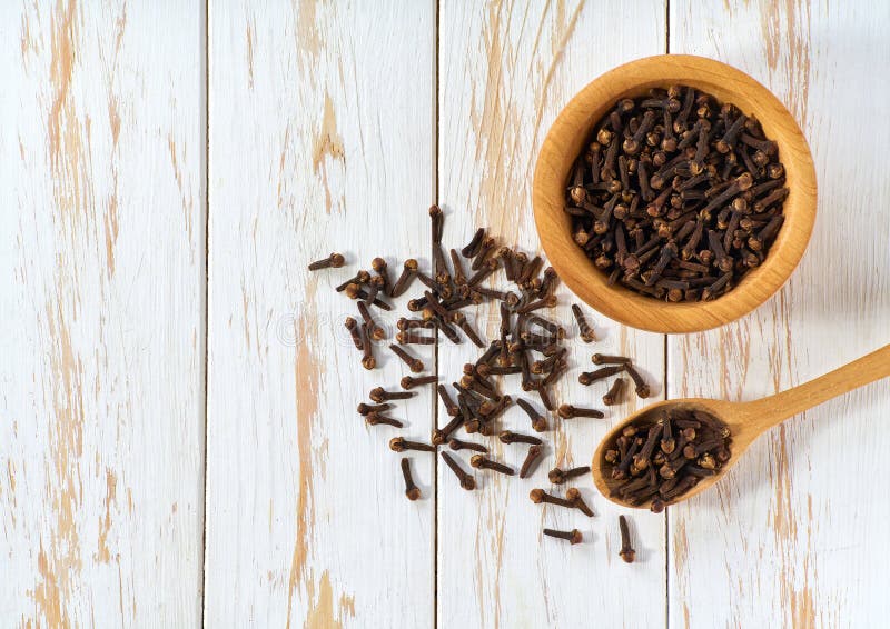 Cloves Spice in a Wooden Spoon on a Light Kitchen Table, Top View Stock ...