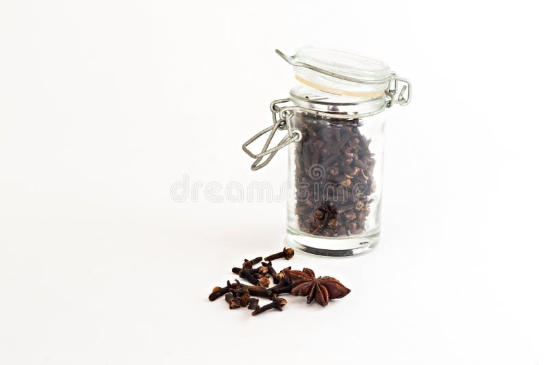 Cloves Spilled from Glass Container Isolated Stock Image - Image of ...