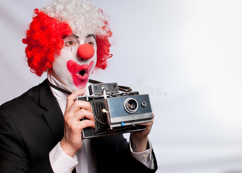 Clown Der Sofortigen Kamera Stockbild - Bild von dumm, liebling: 23899951