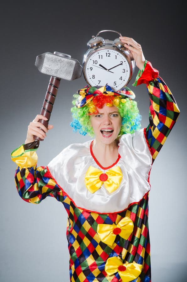 Clown with Hammer and Clock Stock Photo - Image of clock, birthday ...