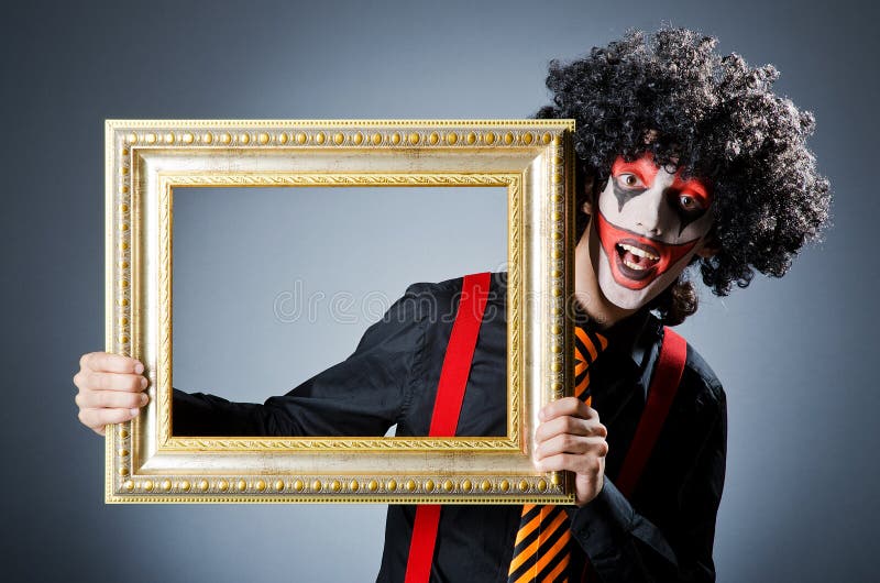 Clown with picture frames stock photo. Image of dressed - 25870902