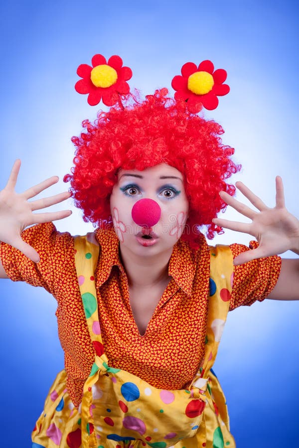 Clown Woman on Blue Background Studio Shooting Stock Photo - Image of ...