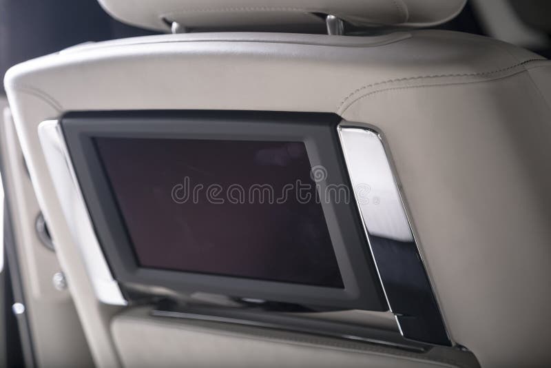 Clsoeup Shot of a Screen on the Back of the Seat in the Modern Car ...