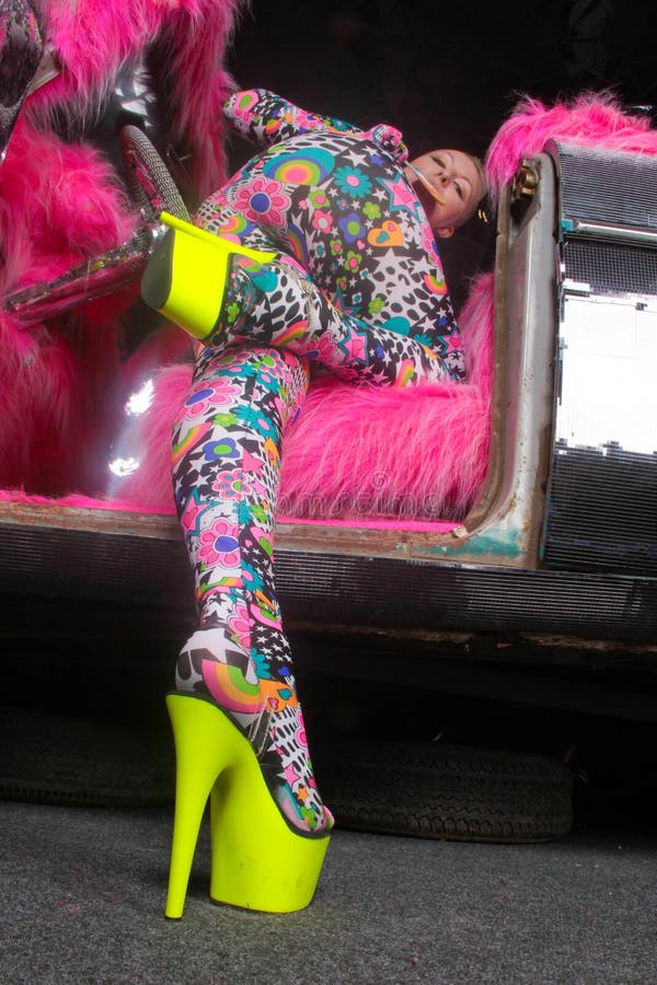 Club Party Blonde Girl In Acid Anime Style Spandex Catsuit With Mirror
