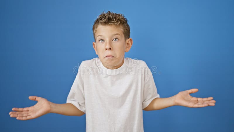 Clueless Blond Boy, with Adorable Expression, Standing Uncertain on ...
