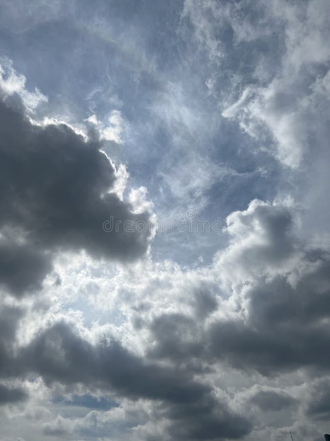 Clumps of Clouds are Illuminated by Sunlight and Emit Whie Light Behind ...