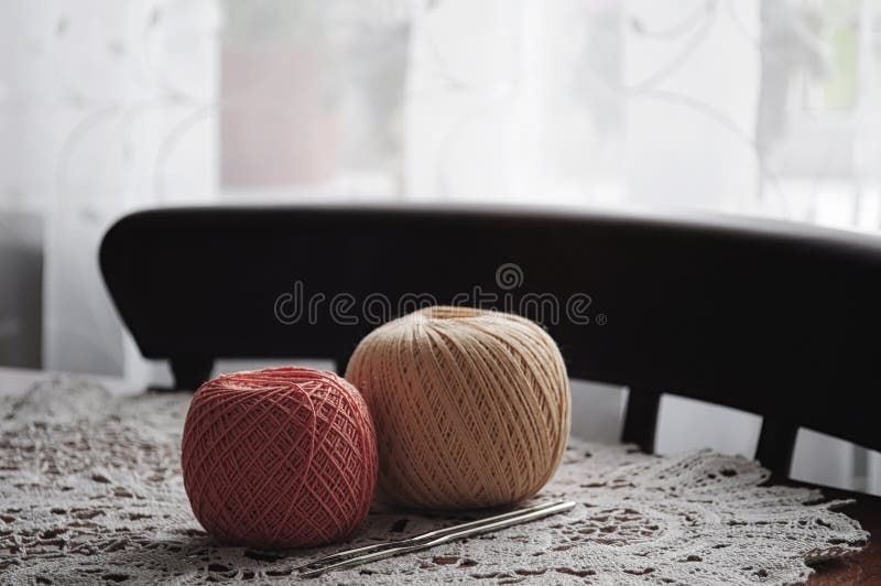 Clumps of Yarn and Knitting Needles on the Table Stock Photo - Image of ...