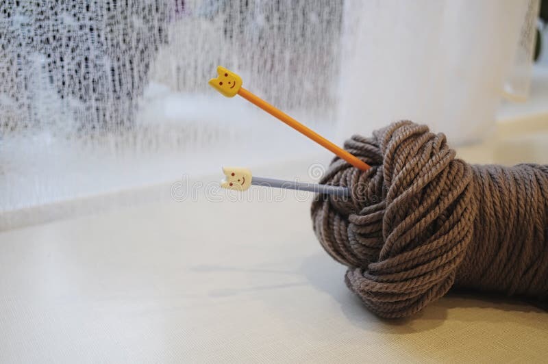 Clumps of Yarn and Knitting Needles on the Table Stock Image - Image of ...