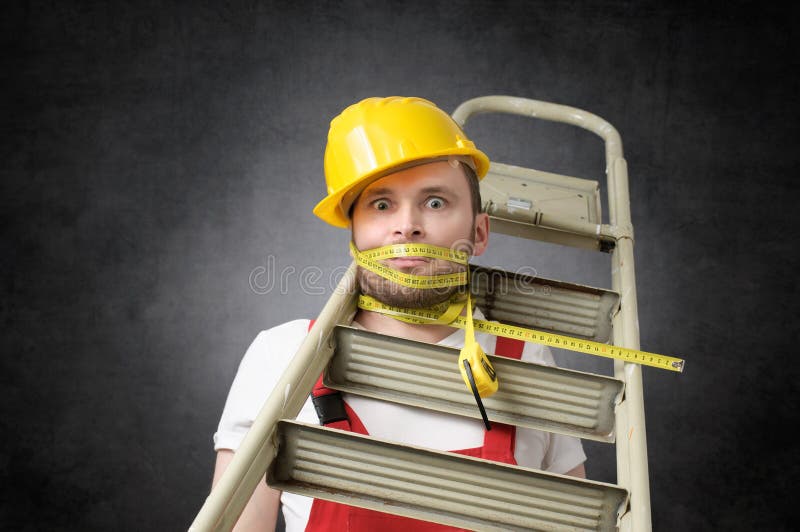 Clumsy Worker with Measure Tape Stock Photo - Image of contractor ...