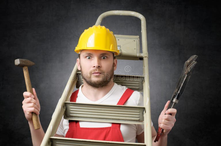 Clumsy worker with tools stock photo. Image of renovation - 108944154
