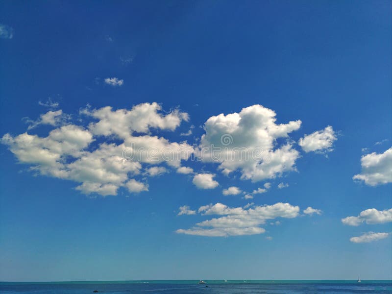 A Cluster of Small White Clouds Against the Blue Sky. Stock Photo ...