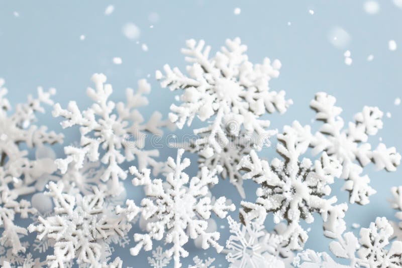 A Cluster of Snowflakes Floating in Mid-air Against a Bright Blue ...
