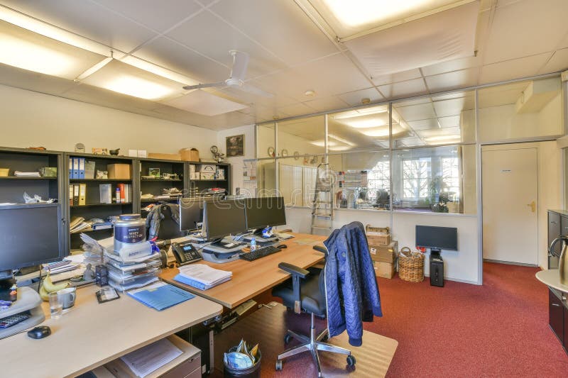 A Cluttered Office with a Desk and a Window Editorial Photography ...