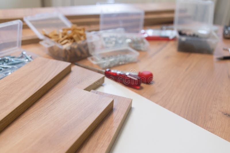 Cluttered Workspace with Tools and Hardware on a Wooden Surface Stock Photo - Image of hardware ...