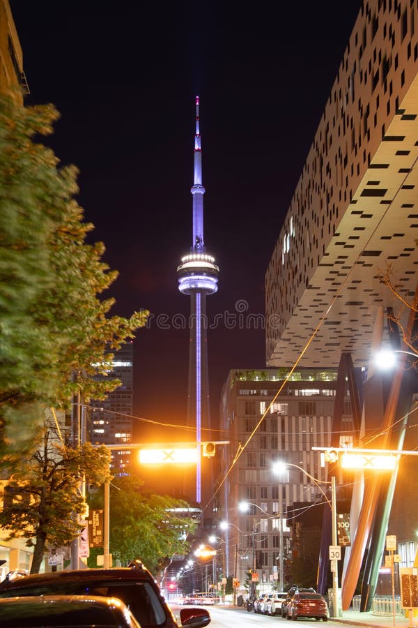 The CN Tower Beautifully Illuminates the Toronto Skyline at Night Time ...