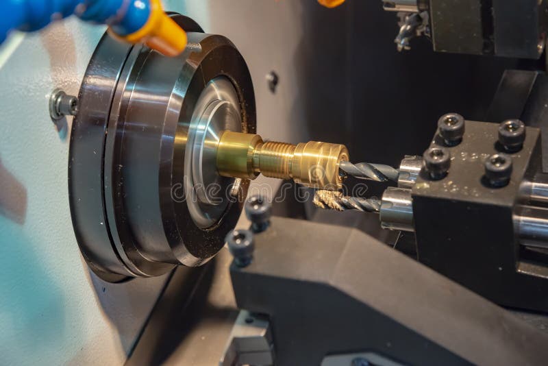 The CNC Lathe Machine Cutting the Brass Shaft Stock Photo - Image of ...