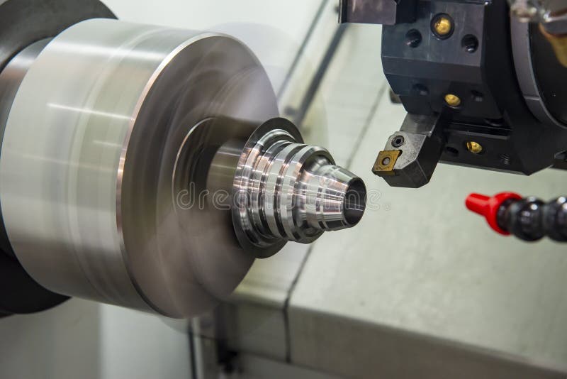 The CNC Lathe Machine Finish Cutting the Metal Cone Shape Parts with ...