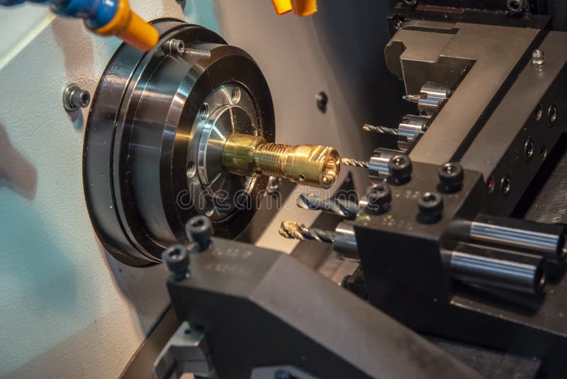 The CNC Lathe or Turning Machine Cutting the Thread at the Brass Shaft ...
