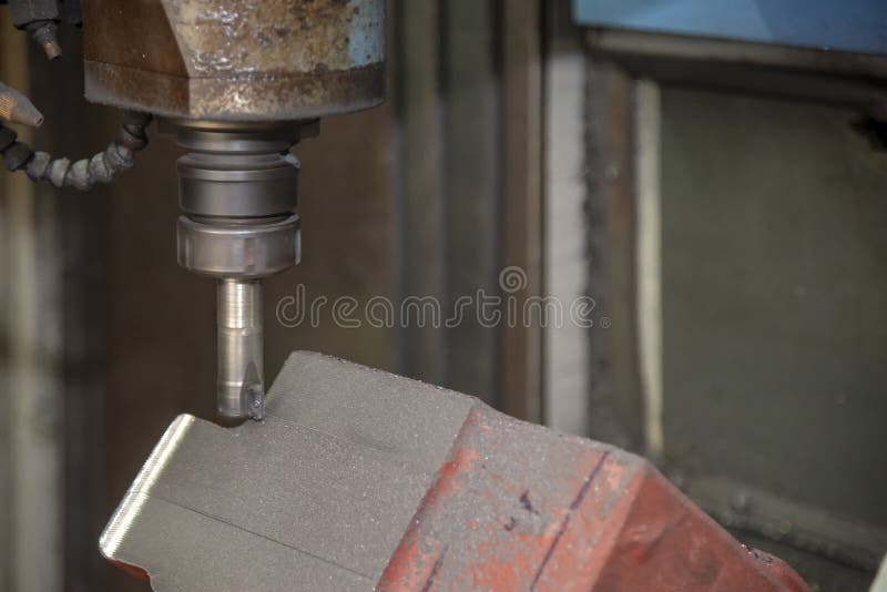The CNC Milling Machine Cutting the Cast Iron Stock Photo - Image of ...