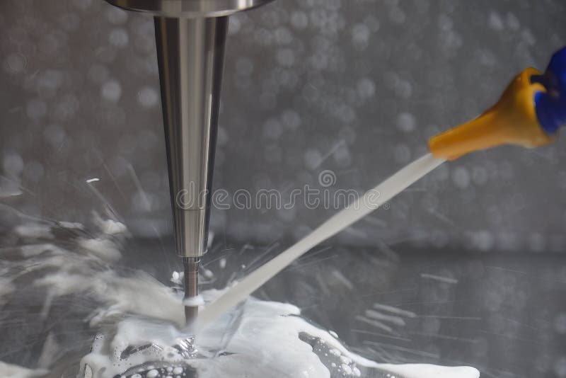 The CNC Milling Machine Cutting the Mold Parts with Water Base Coolant ...
