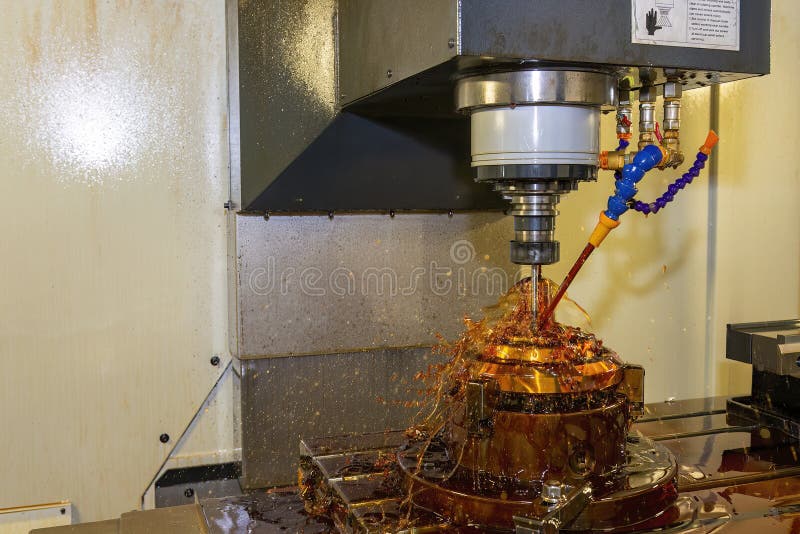 The CNC Milling Machine Cutting the Shell Mold Parts with Oil Coolant ...