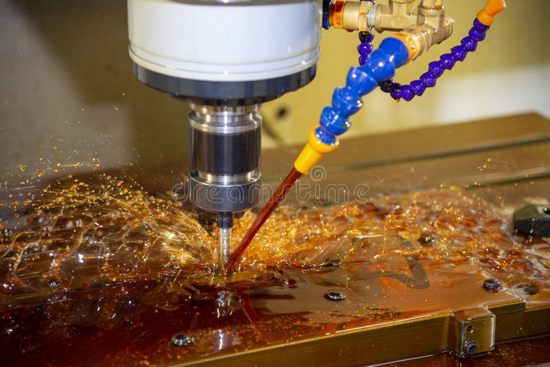 The Cnc Milling Machine Cutting The Tire Mold Parts With Liquid Oil