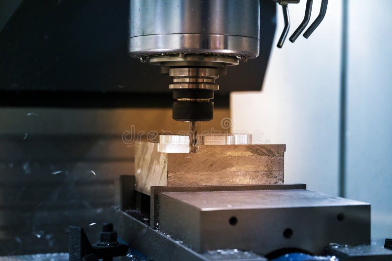 CNC Milling Machine Drilling at the Metal Part by Flat Drill Tools. the ...