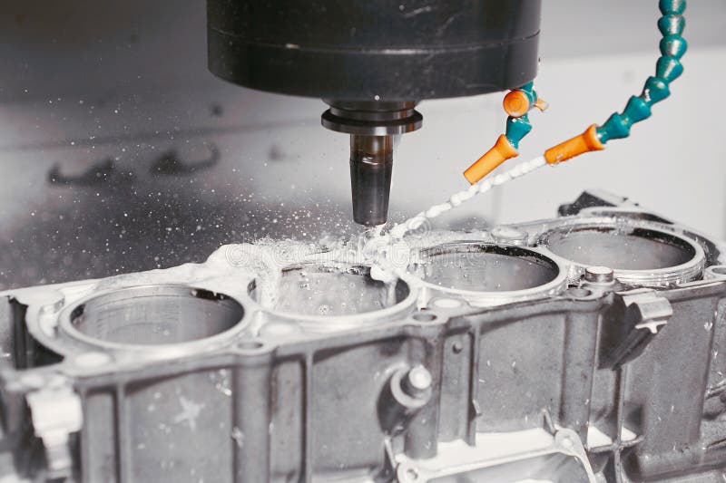 CNC Milling Machine Grinds Holes in Car Engine with Coolant. Process of ...