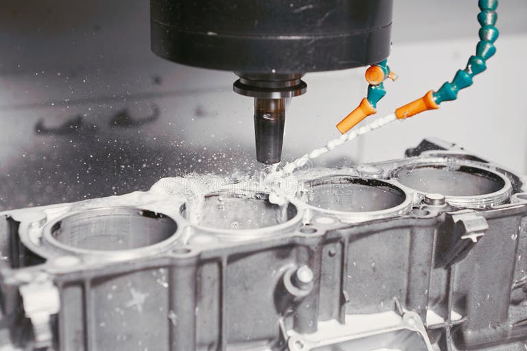 CNC Milling Machine Grinds Holes in Car Engine with Coolant. Process of ...