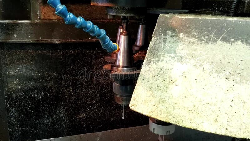 CNC Milling Machine in the Process of Processing a Workpiece in Three ...