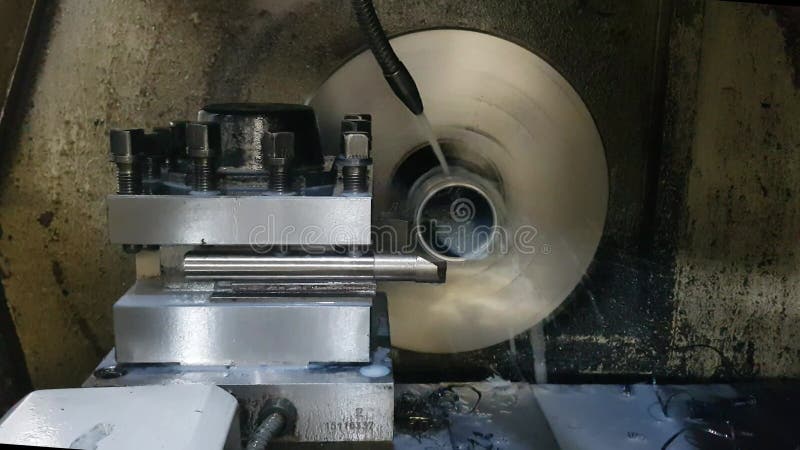 CNC Milling Machine in the Process of Processing a Workpiece in Three ...