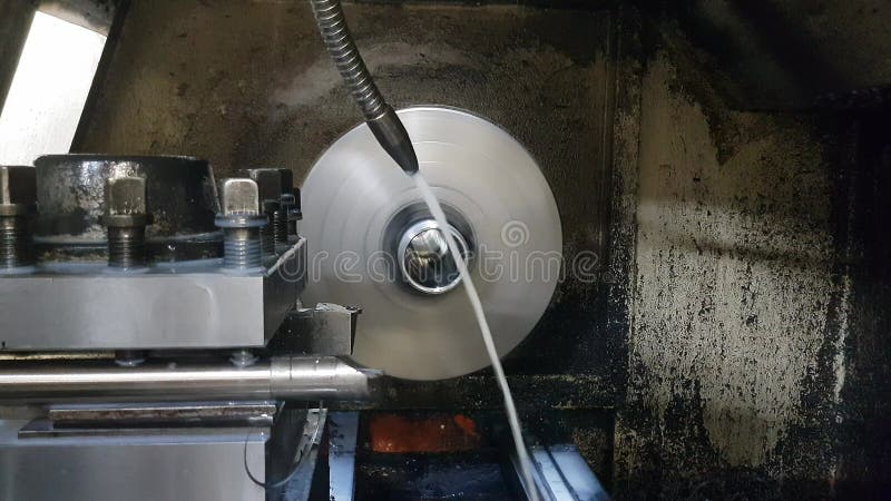CNC Milling Machine in the Process of Processing a Workpiece in Three ...