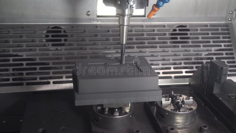 The CNC Milling Machine Rough Cutting the Graphite Electrode Parts with ...
