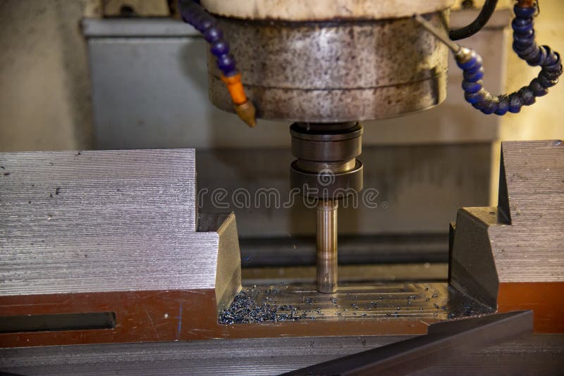 The CNC Milling Machine Rough Cutting the Mold Parts with the Indexable ...