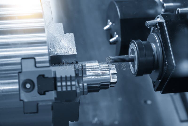 The CNC Turn-mill Machine Chamfer Cutting the Metal Shape Parts Stock ...