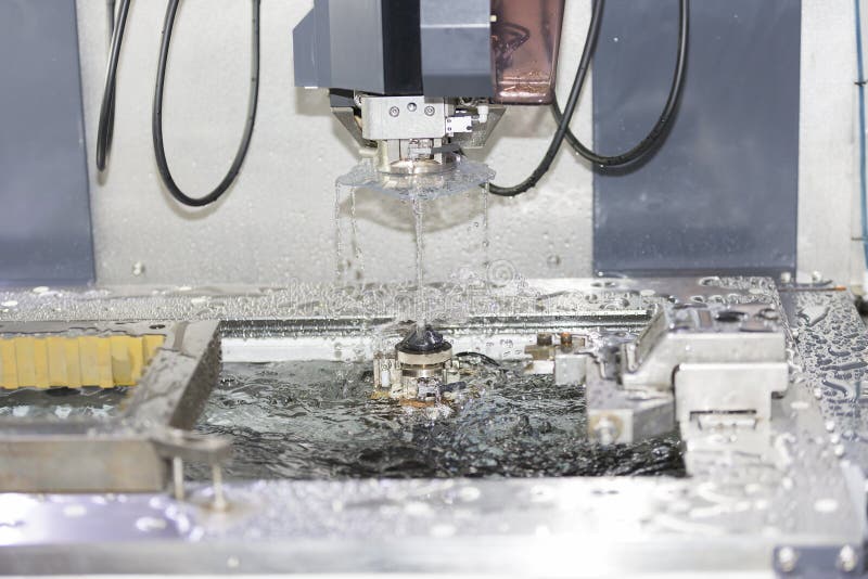 CNC Wire Cut Machine Cutting Mold Parts Stock Photo - Image of metallic ...