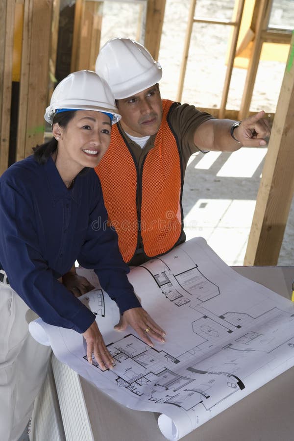Co-Worker Discussing with Female Engineer Stock Image - Image of ...