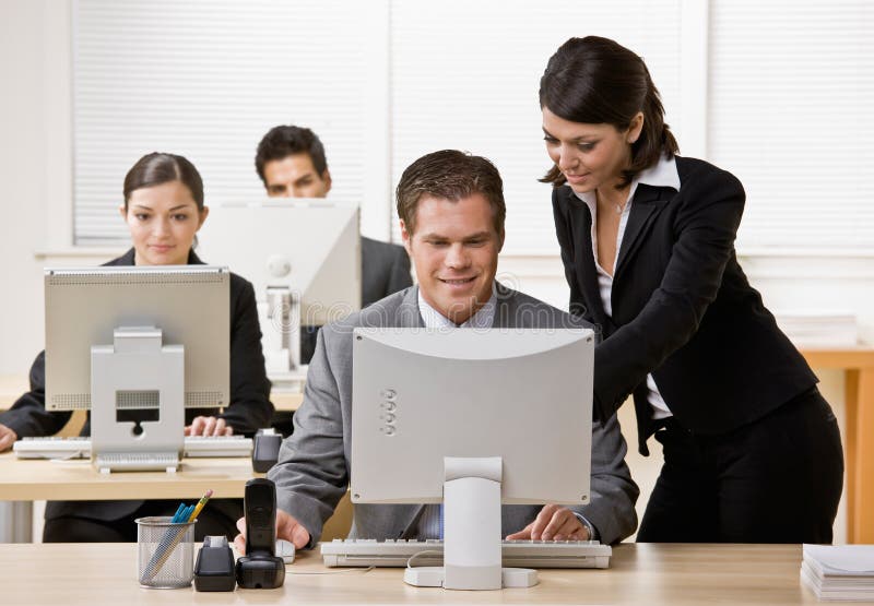 Supervisor Explaining Work To Young Businessman Stock Image - Image of ...