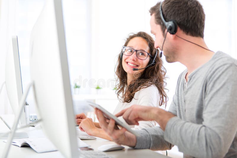 Workers in a Call Centre with Earpiece on Stock Photo - Image of ...