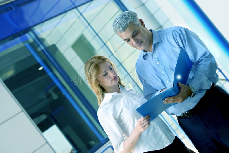 Co-Workers Collaborating stock image. Image of consulting - 1557453