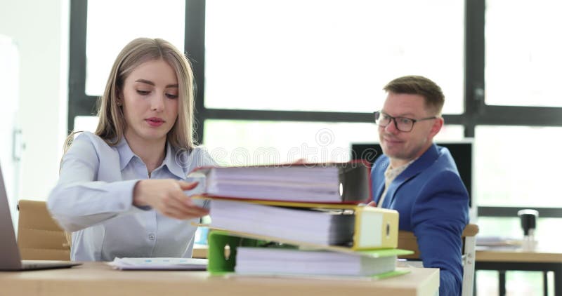 Co-workers Exchange Documentation Sitting at Workplace Stock Video ... Co-workers Exchange Documentation Sitting at Workplace Stock Video ...