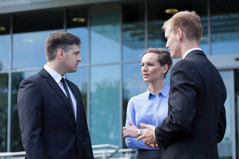 Co-workers in Front of Business Centre Stock Image - Image of building ...